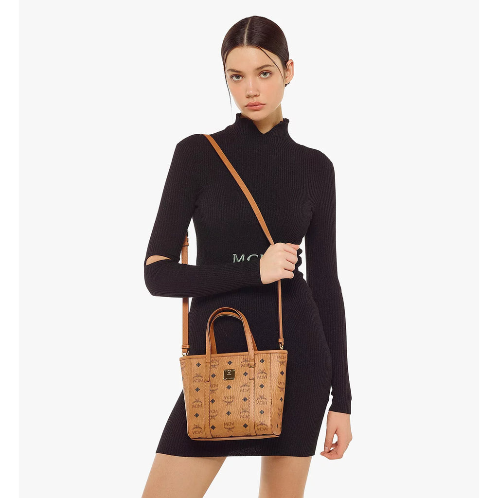 MCM A compact shopper with unmatched versatility, accompanied by a lea ...