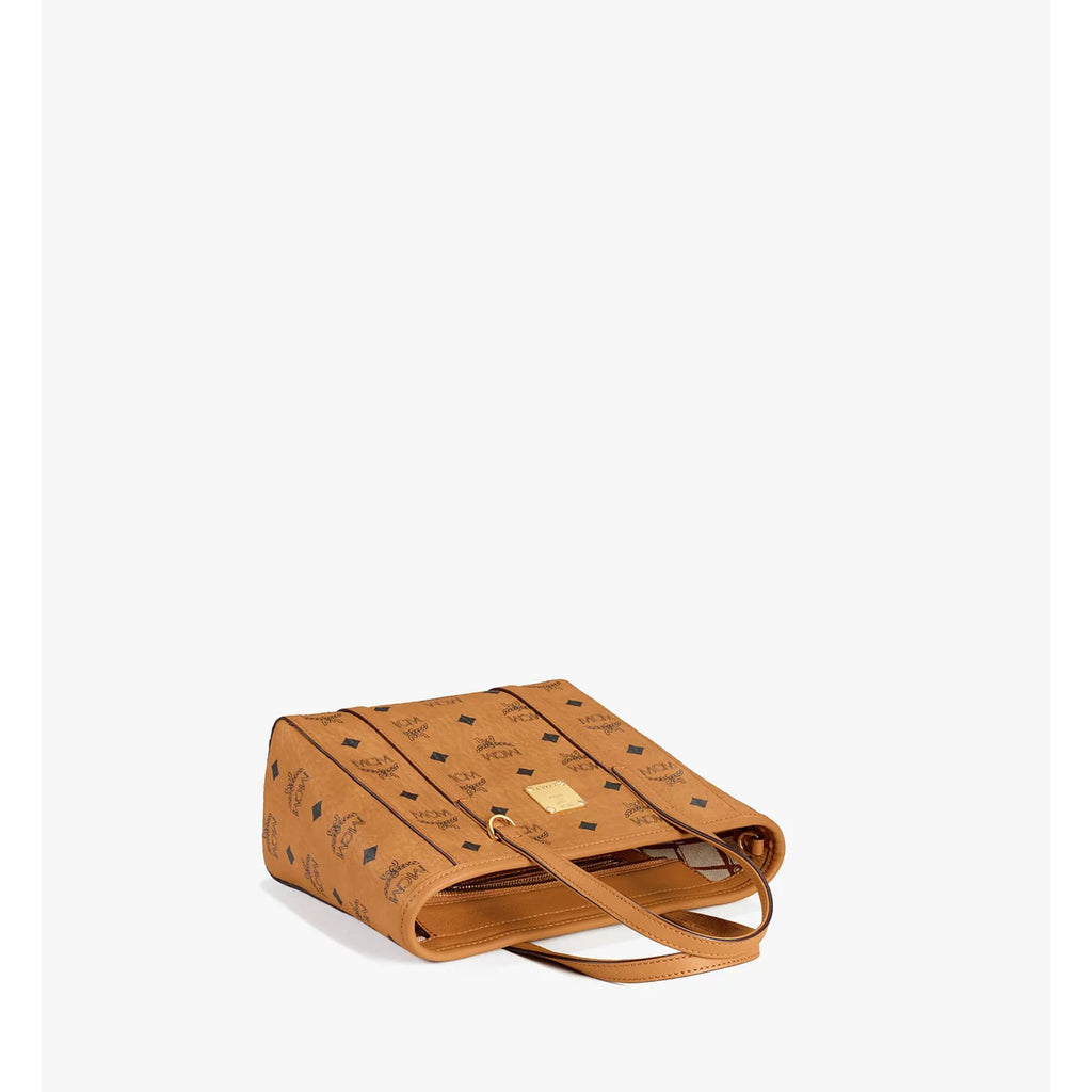MCM A compact shopper with unmatched versatility, accompanied by a lea ...